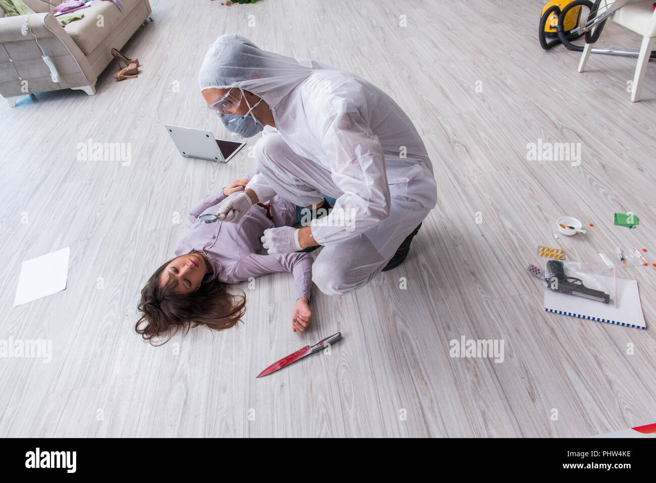Forensic Investigator At The Crime Scene Investigating Woman Mur Stock