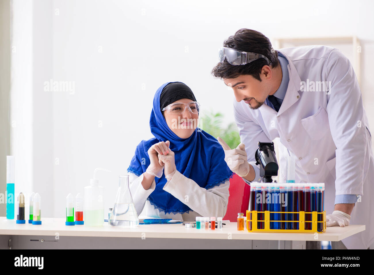 Diverse chemists working in laboratory hi-res stock photography and ...