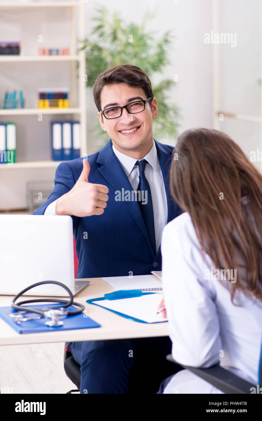Man signing medical insurance contract Stock Photo - Alamy