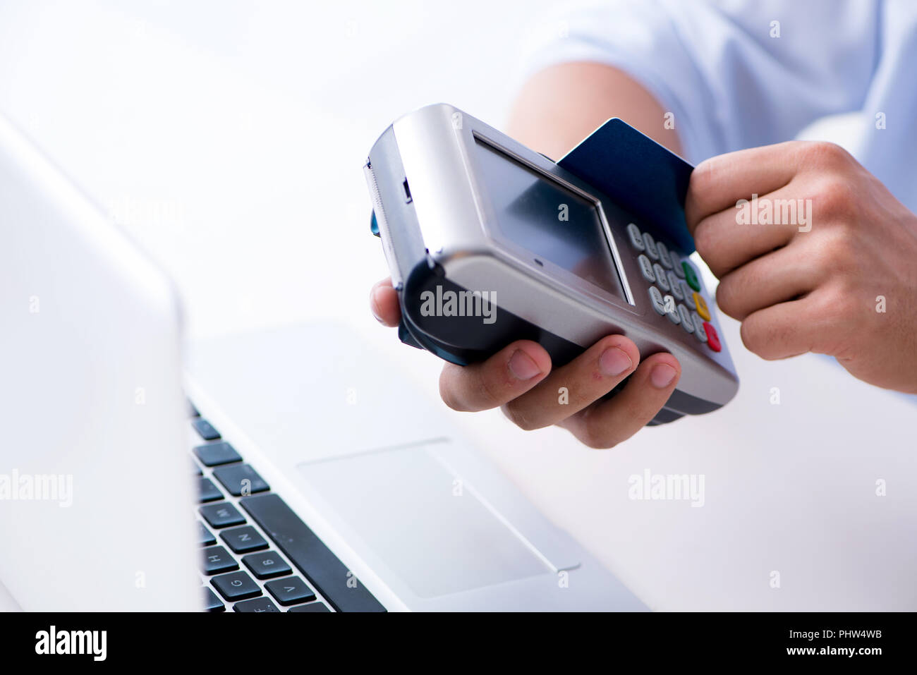 Man processing credit card transaction with POS terminal Stock Photo ...