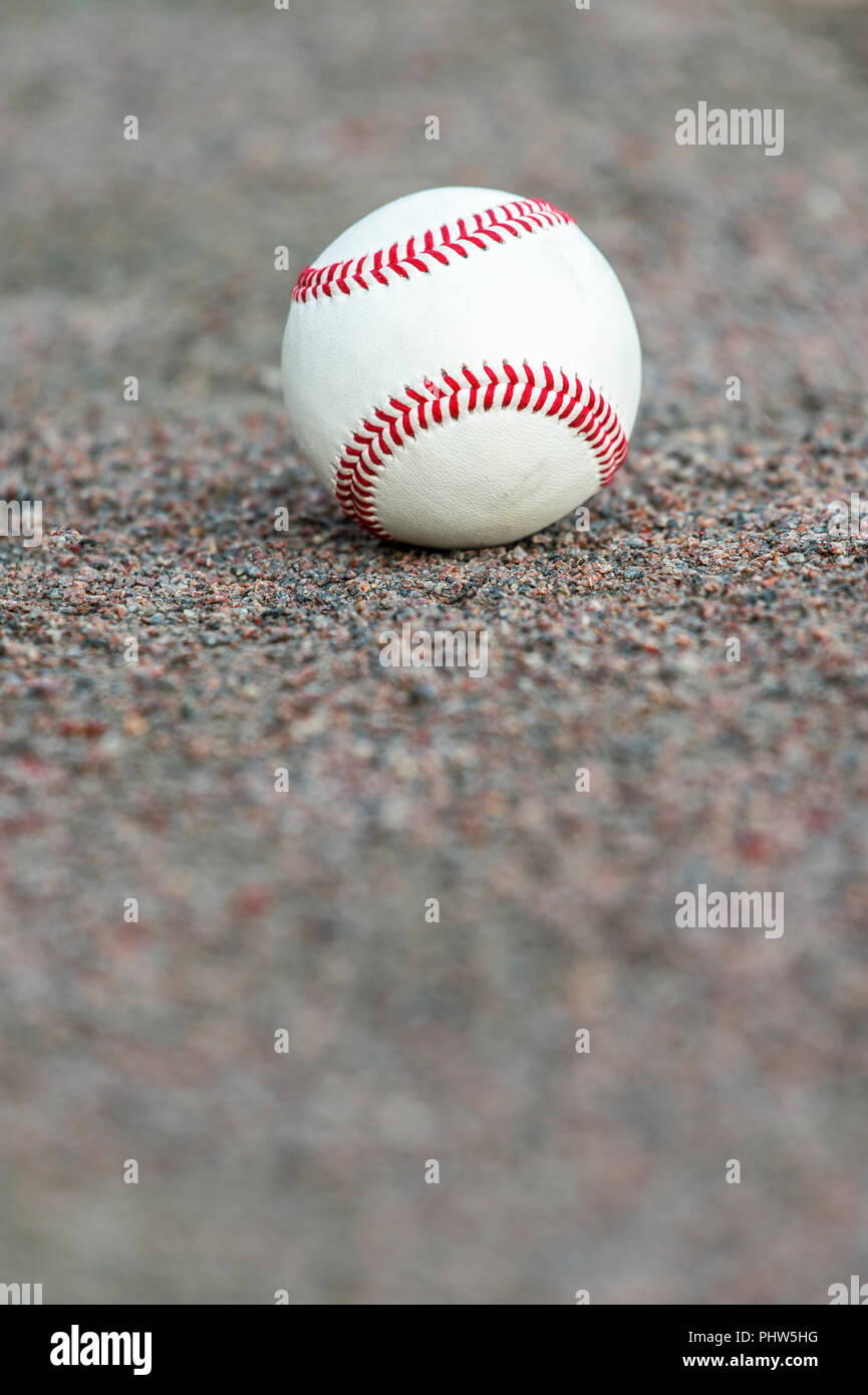 one baseball on infield of sport field Stock Photo - Alamy