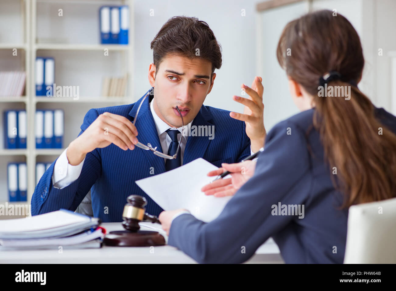 Lawyer talking to his client in office Stock Photo - Alamy