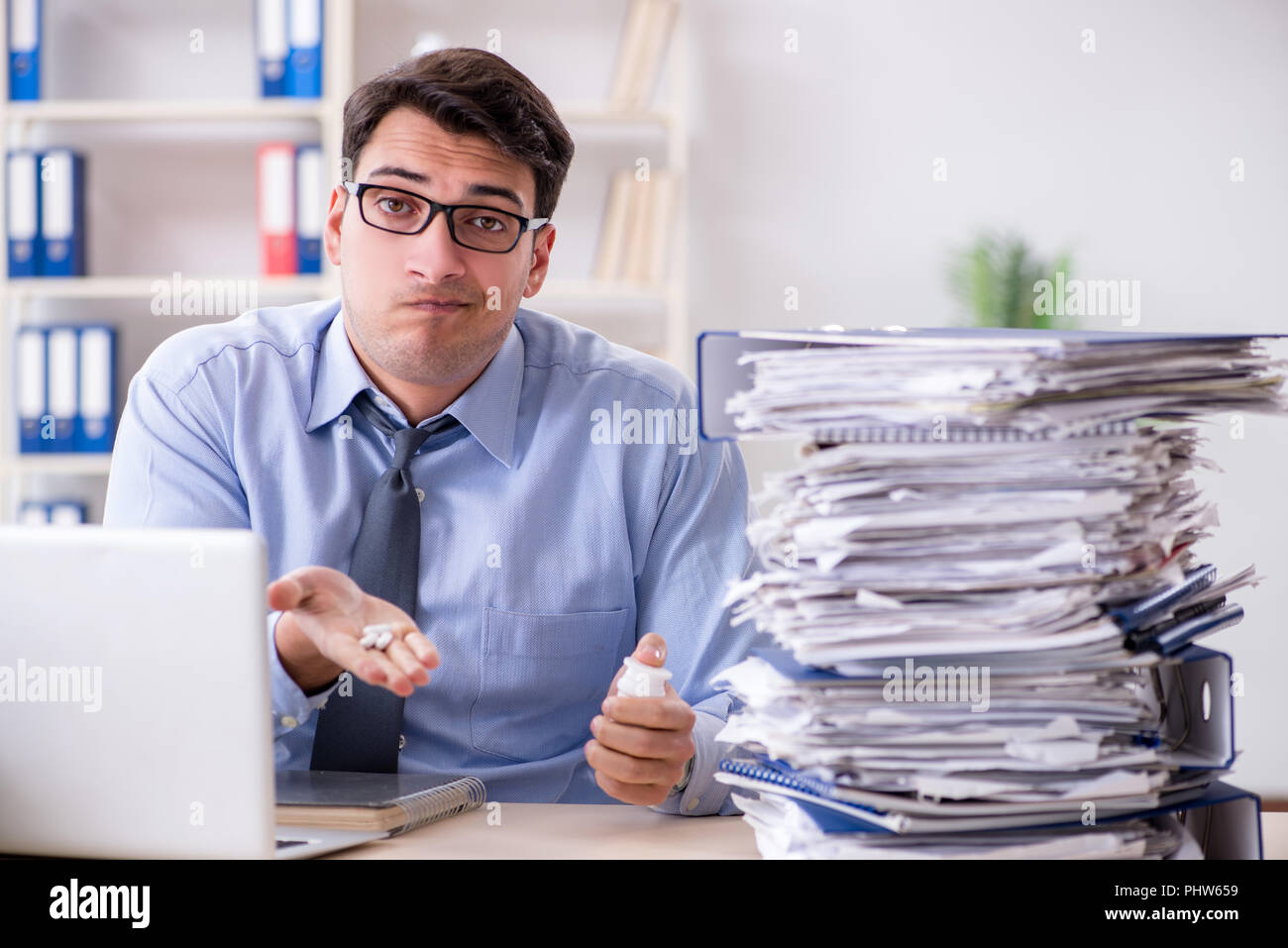 Extremely busy businessman working in office Stock Photo - Alamy