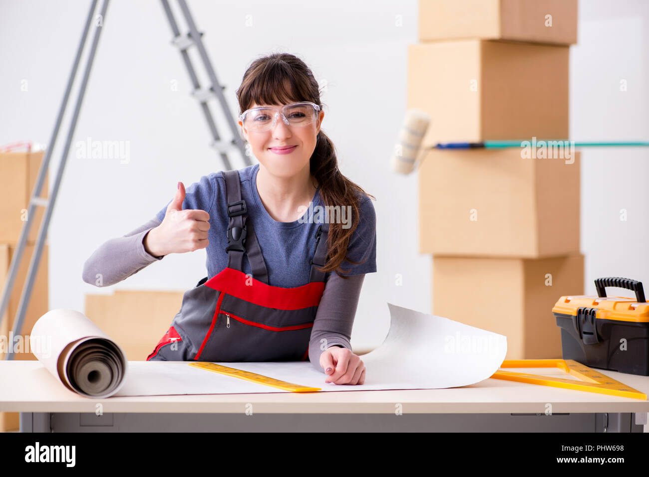 Woman preparing for wallpaper work Stock Photo - Alamy