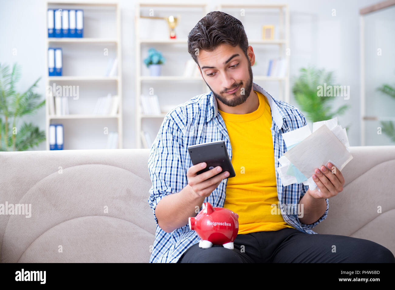 Man angry at bills he needs to pay Stock Photo - Alamy