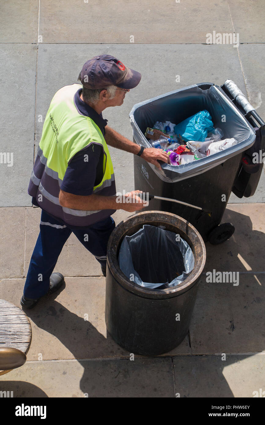Plastics recycle bin worker hi-res stock photography and images - Alamy