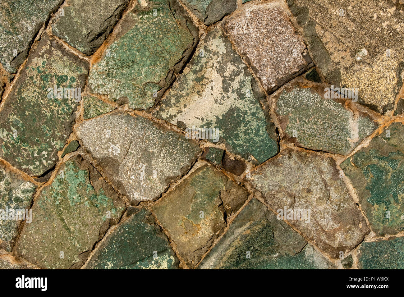 Stone wall as a background or texture. An example of masonry as a ...