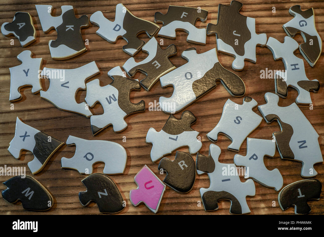 Puzzles with letters of the alphabet scattered on the table ready for ...