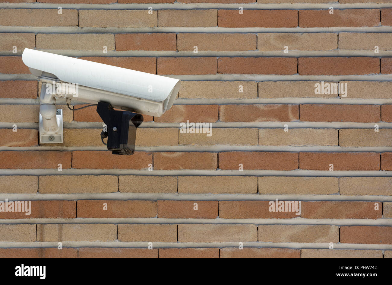 Surveillance camera brick wall Stock Photo - Alamy