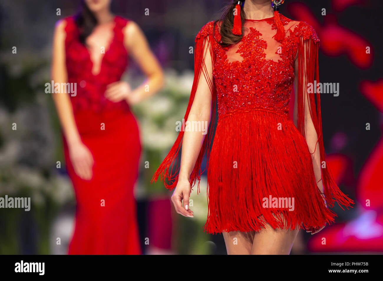 Fashion catwalk runway show models red dress Stock Photo - Alamy
