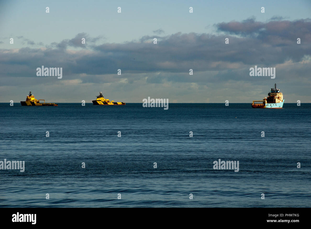 Oil rig support vessels at anchor in the North Sea off the North beech ...