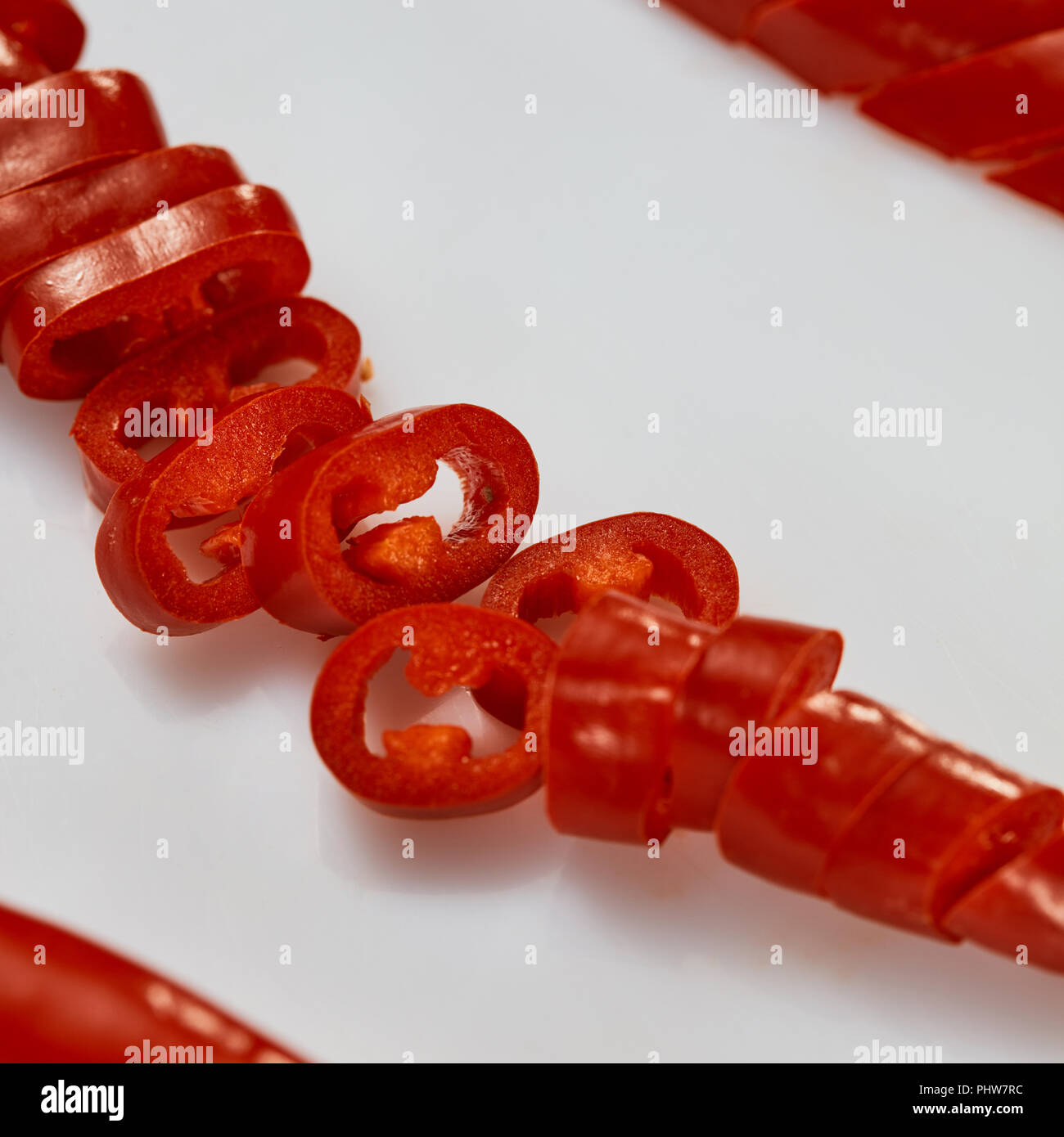 macro photo of chopped red chili pepper on white background Stock Photo ...