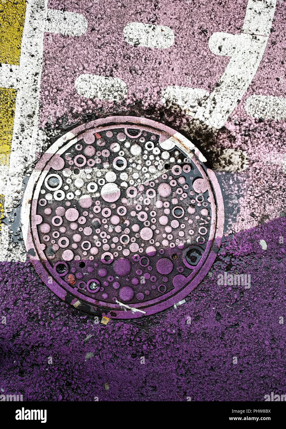 A painted manhold cover in The Pink Alley, Vancouver, BC, Canada Stock ...