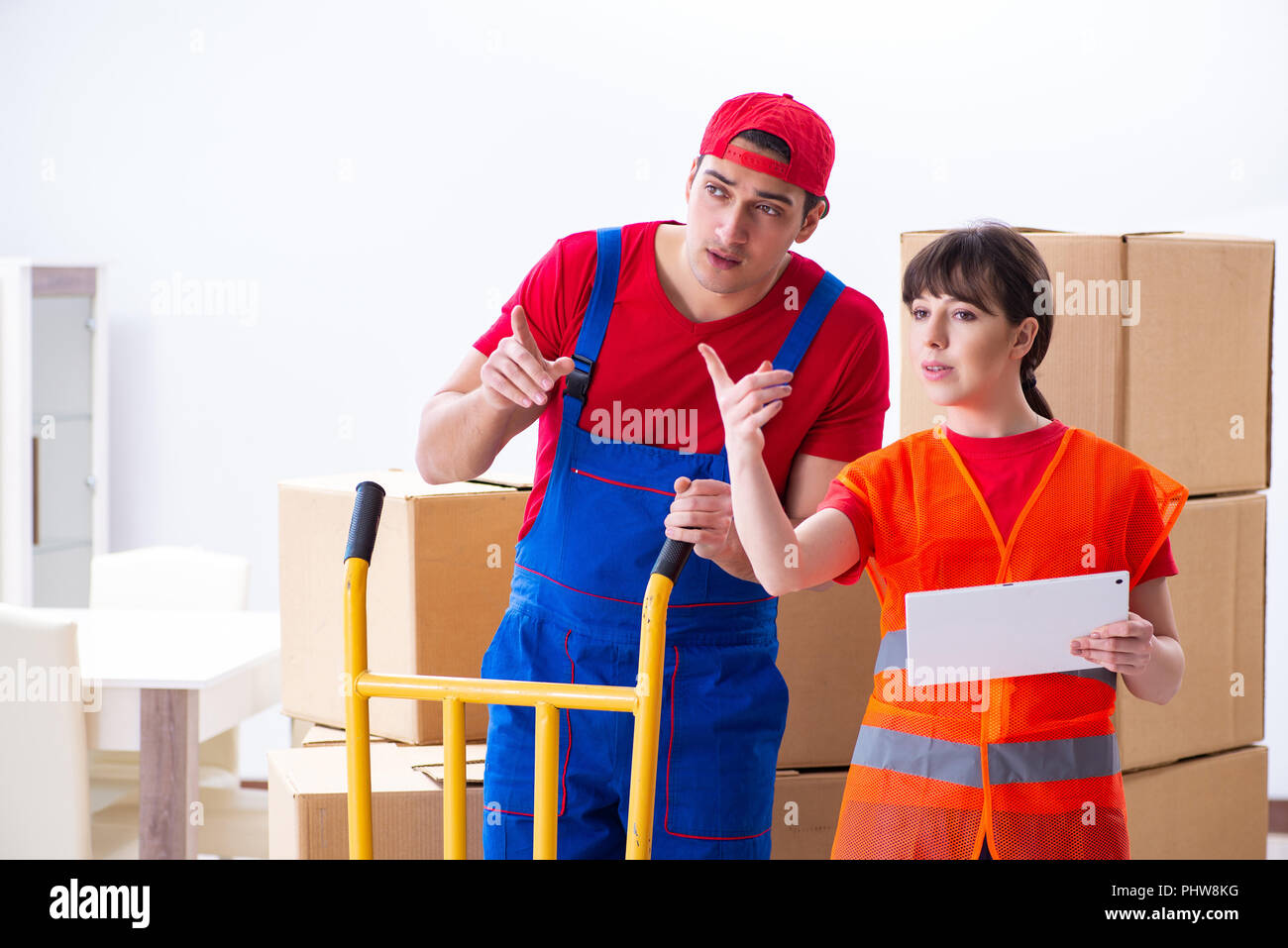 Professional movers doing home relocation Stock Photo - Alamy