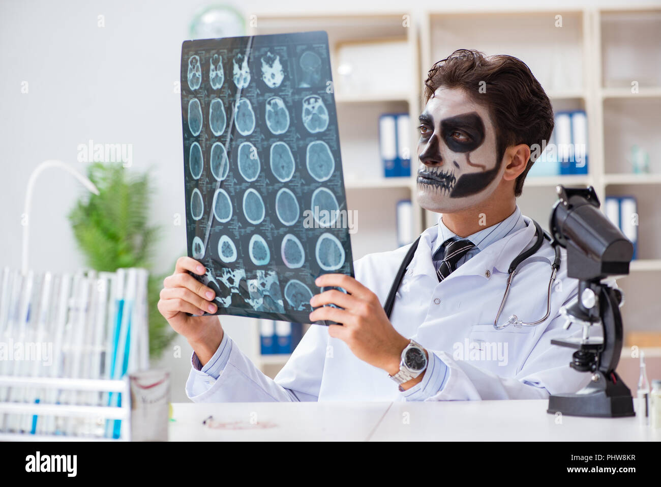 Scary monster doctor working in lab Stock Photo - Alamy