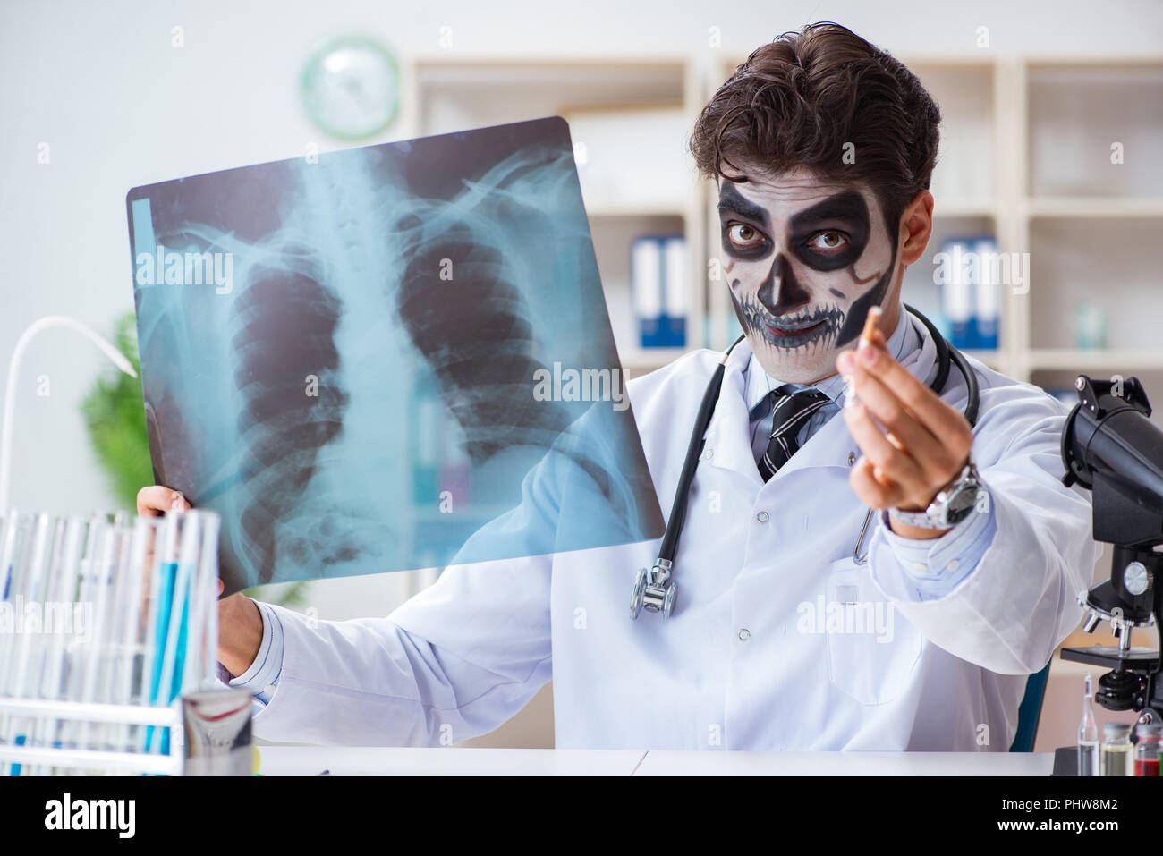 Scary monster doctor working in lab Stock Photo - Alamy