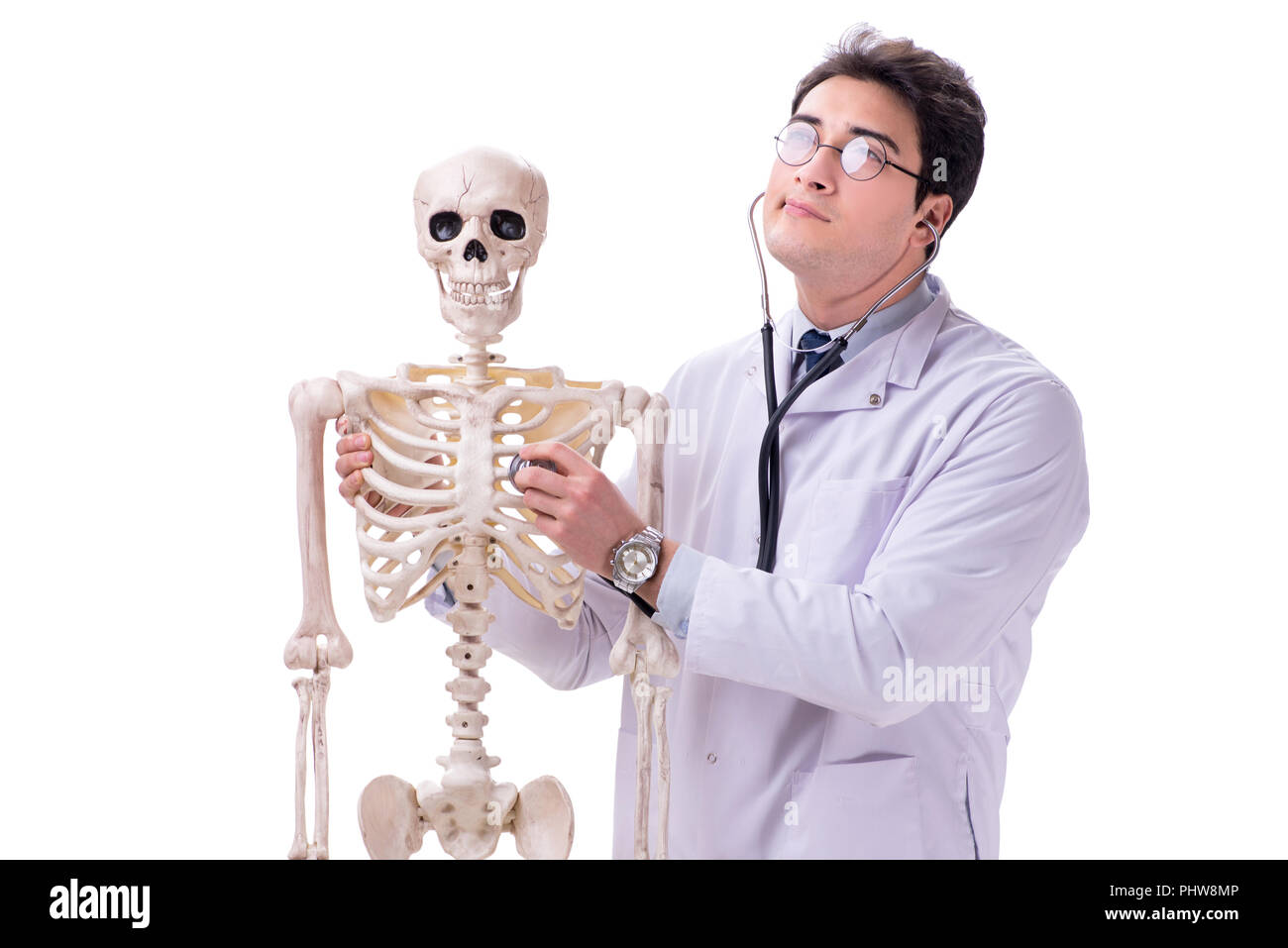 Young doctor with skeleton isolated on white Stock Photo - Alamy
