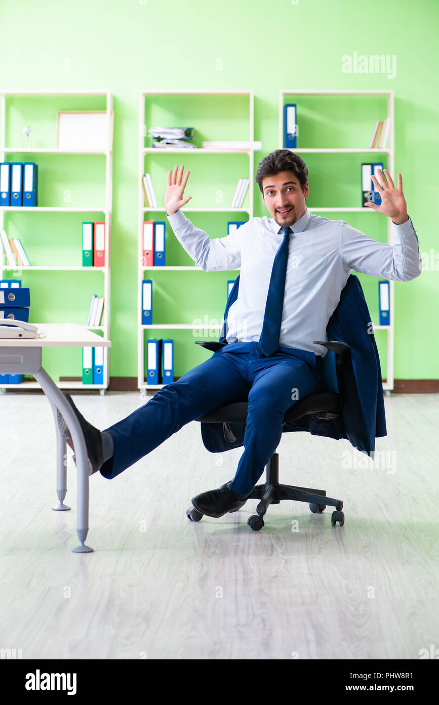 Employee doing exercises during break at work Stock Photo - Alamy