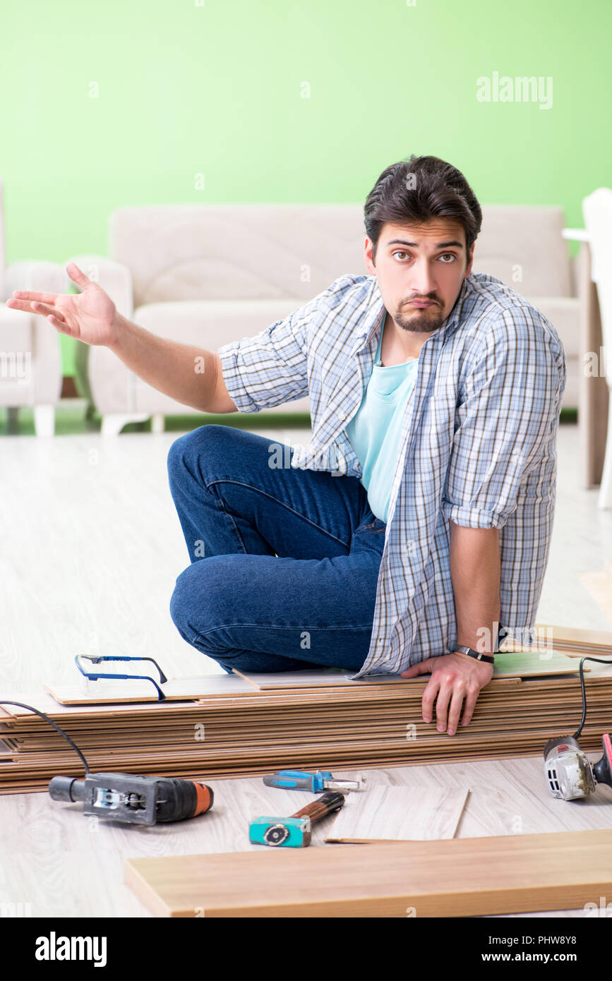 Man showing installation hardwood flooring hi-res stock photography and ...