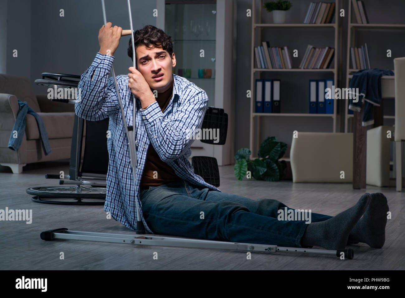 Man falling off chair hi-res stock photography and images - Alamy