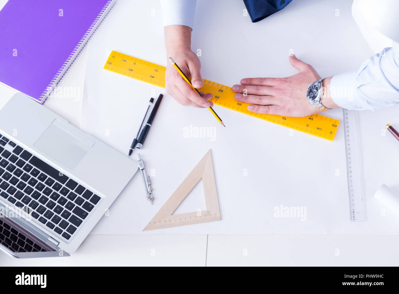 Engineer working on new project drawings Stock Photo - Alamy
