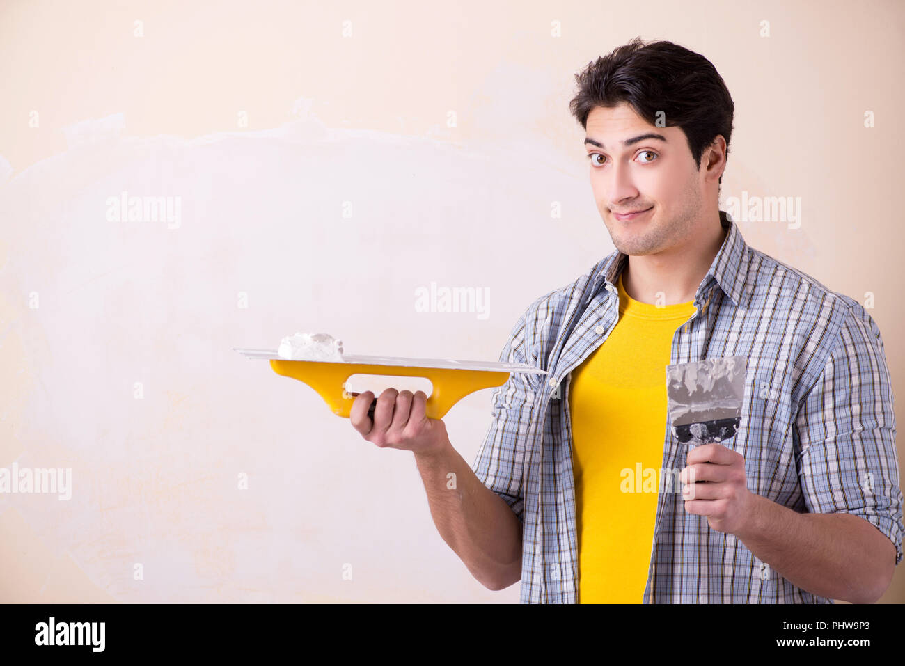 Worker applying plaster on hi-res stock photography and images - Alamy