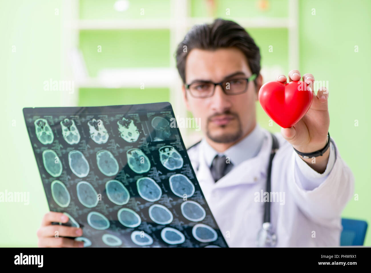 Doctor radiologist looking at x-ray scan in hospital Stock Photo - Alamy