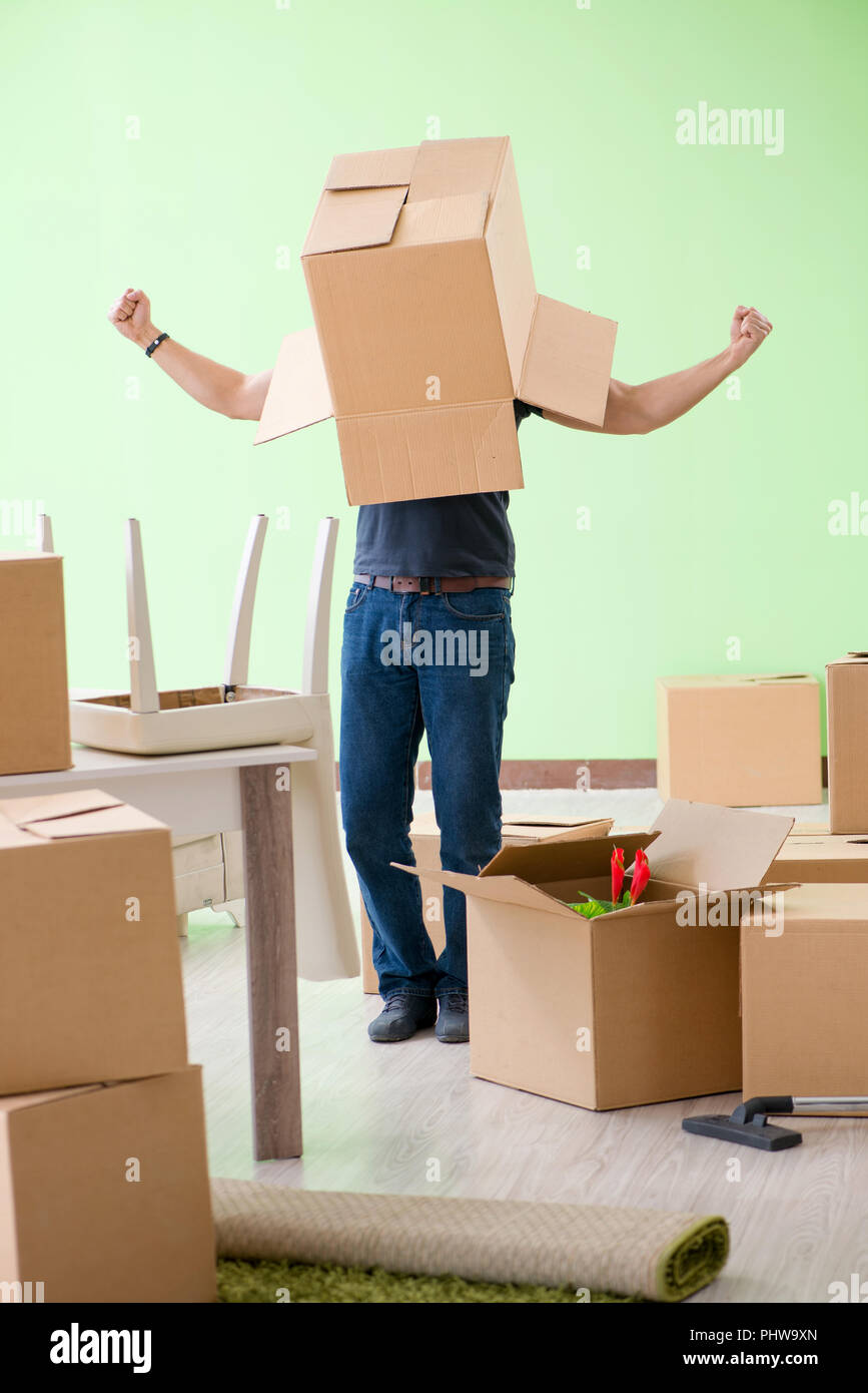 Man moving house with boxes Stock Photo - Alamy