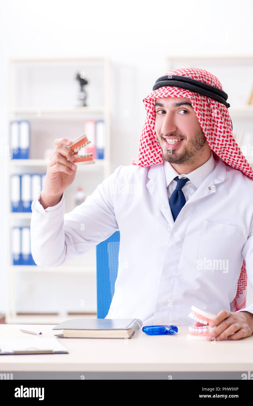 Arab dentist working on new teeth implant Stock Photo - Alamy