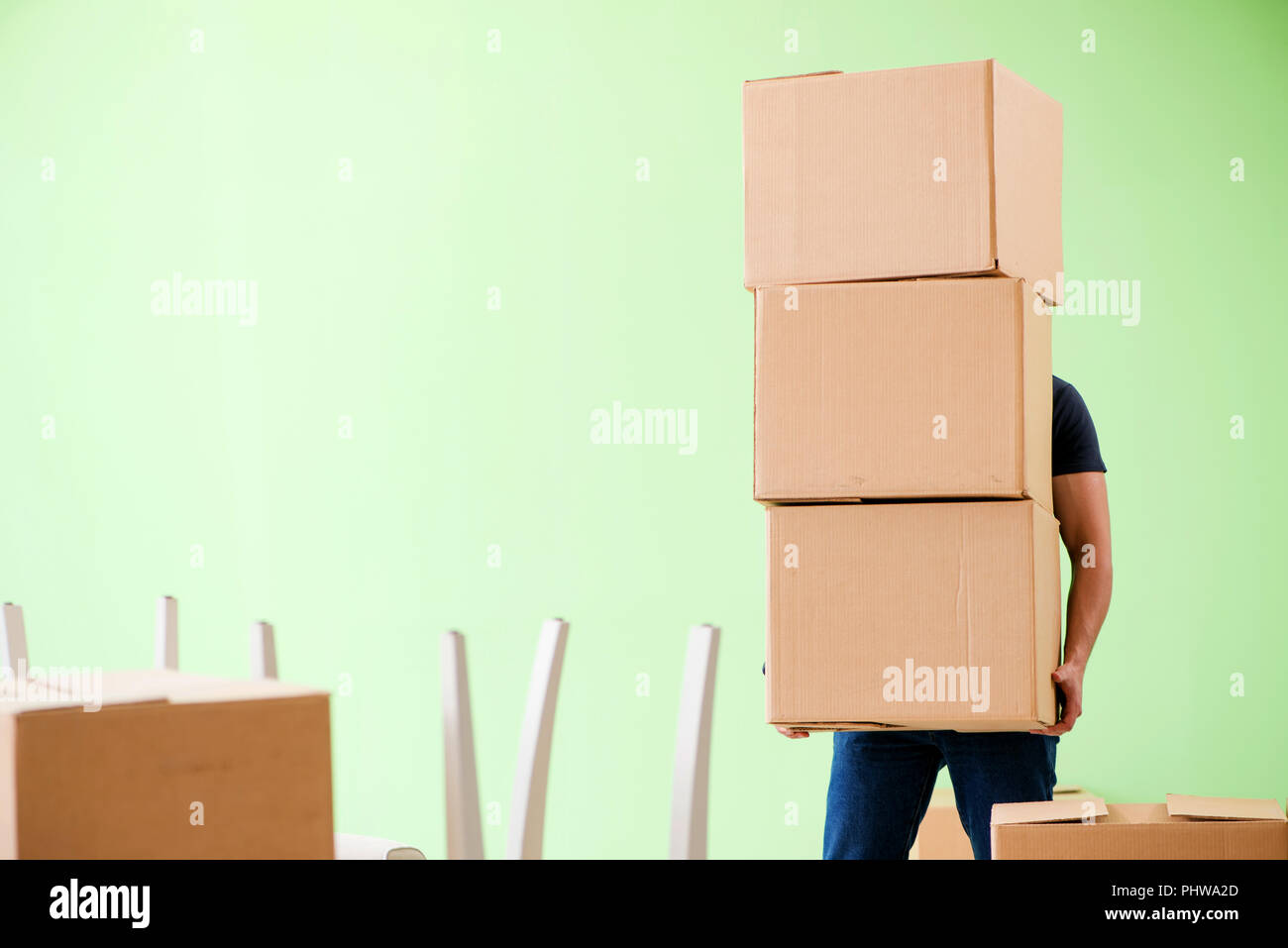 Man moving house with boxes Stock Photo - Alamy