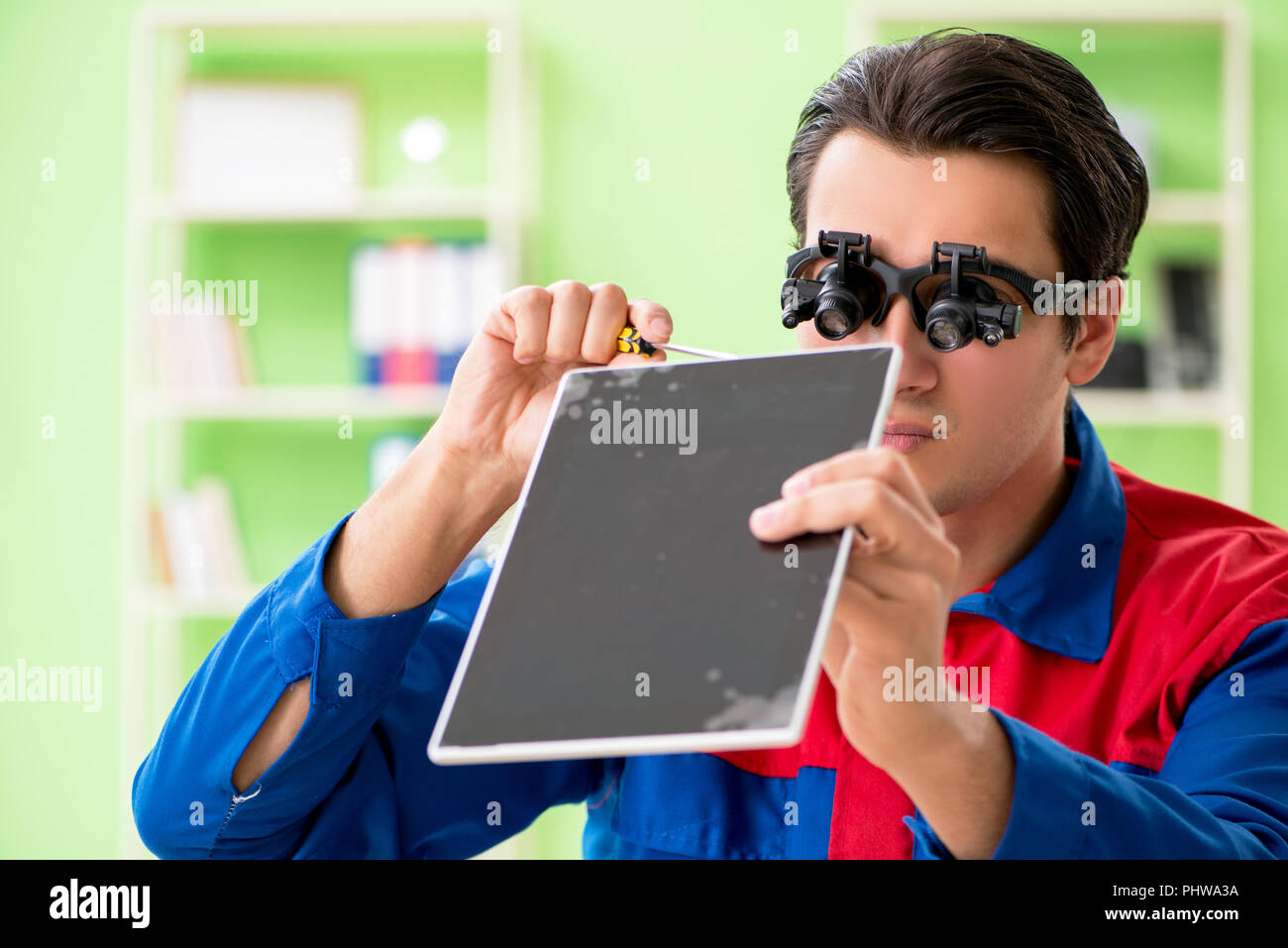 Computer engineer repairing broken desktop Stock Photo - Alamy
