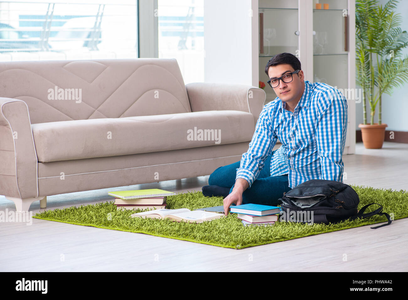 Young student preparing for exams at home Stock Photo - Alamy