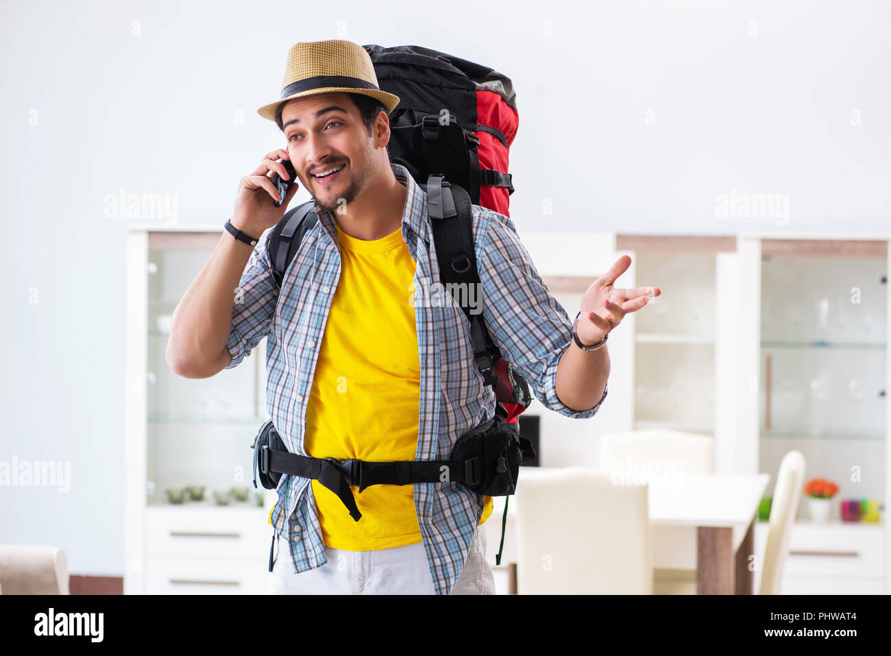 Man packing suitcase talking hi-res stock photography and images - Alamy