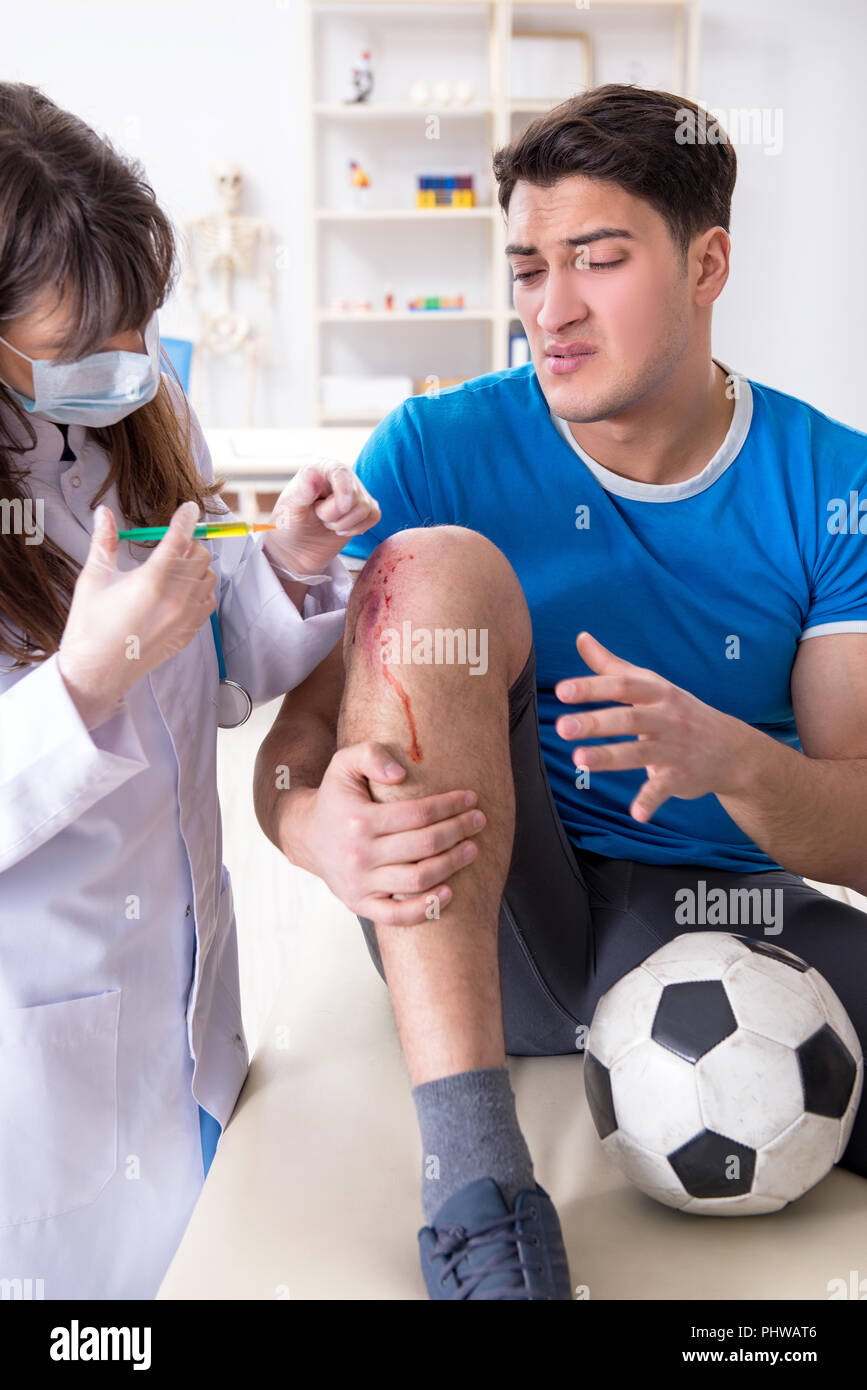 Football soccer player visiting doctor after injury Stock Photo - Alamy