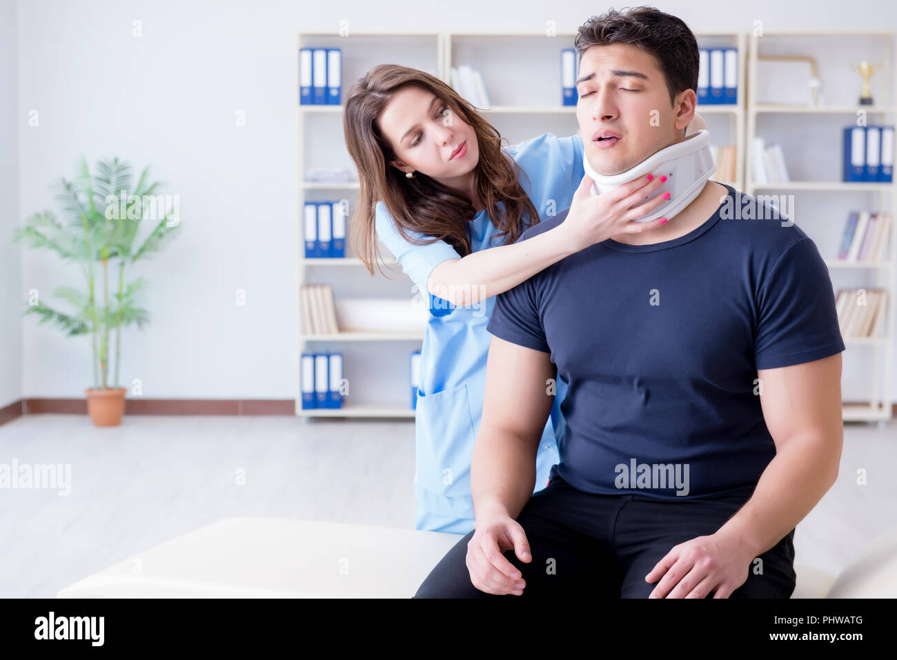 Man with neck injury visiting doctor for check-up Stock Photo - Alamy