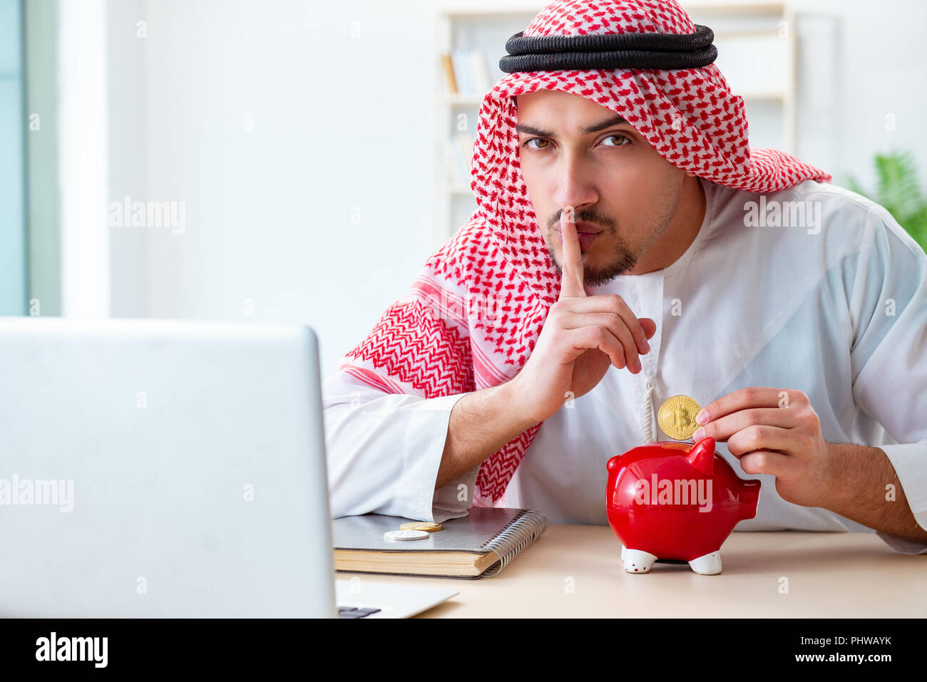 Arab man with bitcoin in cryptocurrency mining concept Stock Photo - Alamy