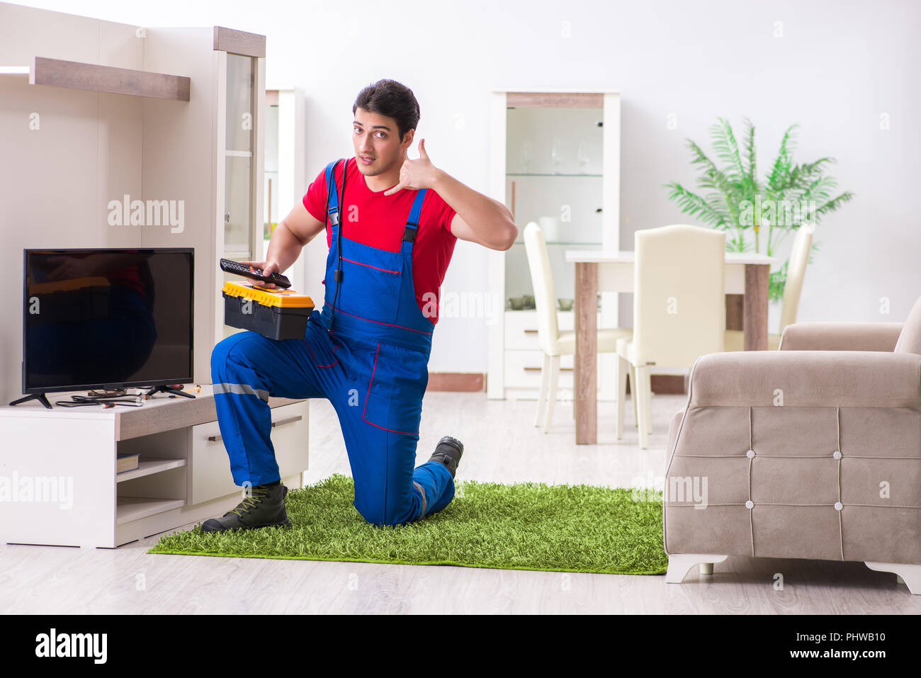 Professional repair engineer repairing broken tv Stock Photo - Alamy