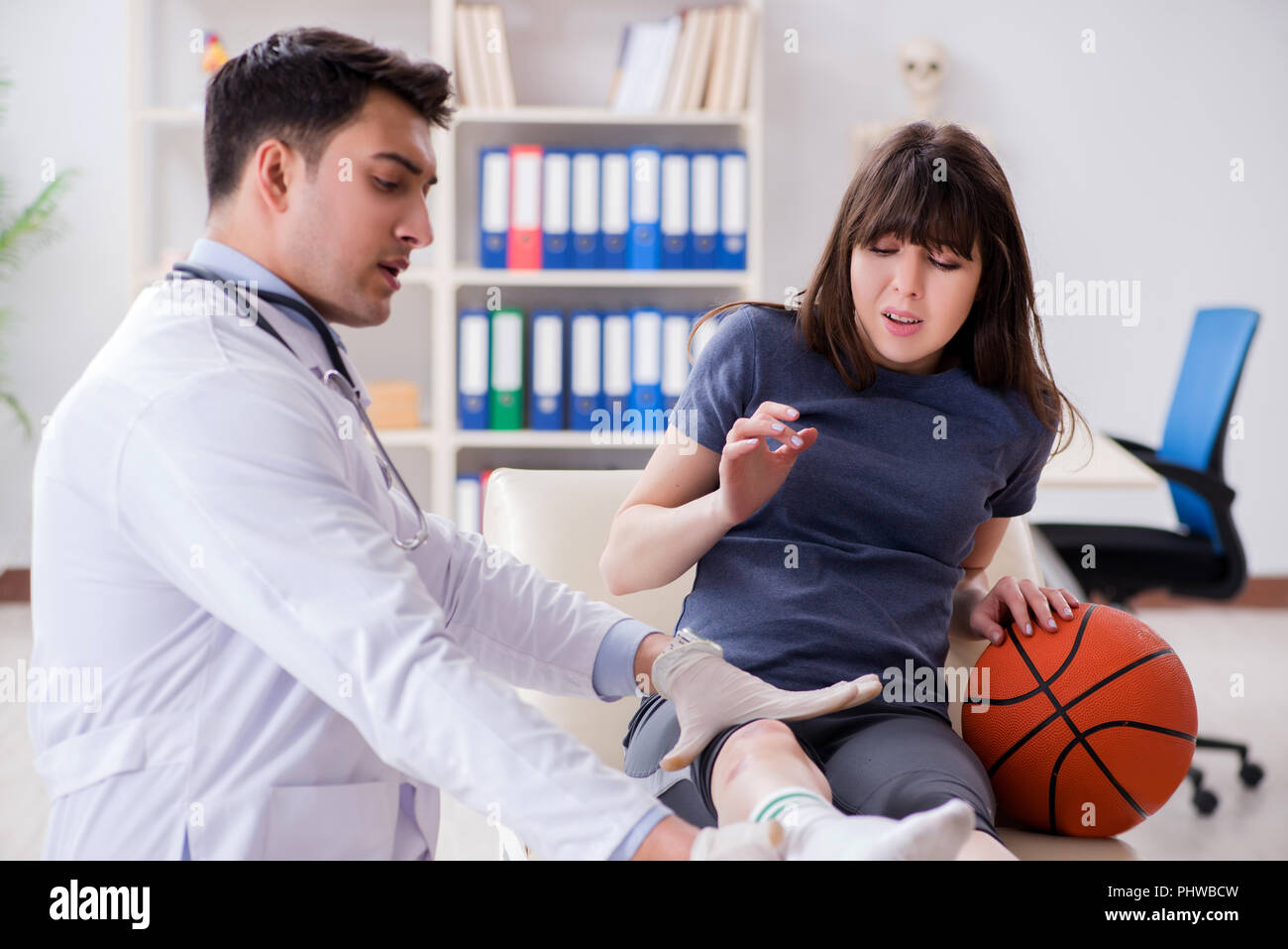 Female basketball player visiting doctor after injury Stock Photo - Alamy