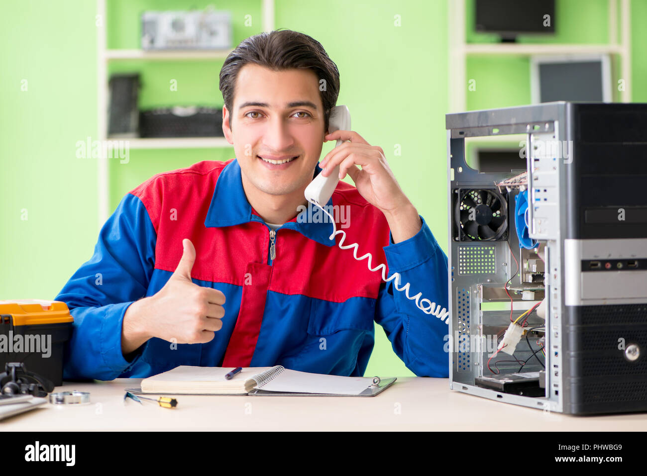 Computer engineer repairing broken desktop Stock Photo - Alamy