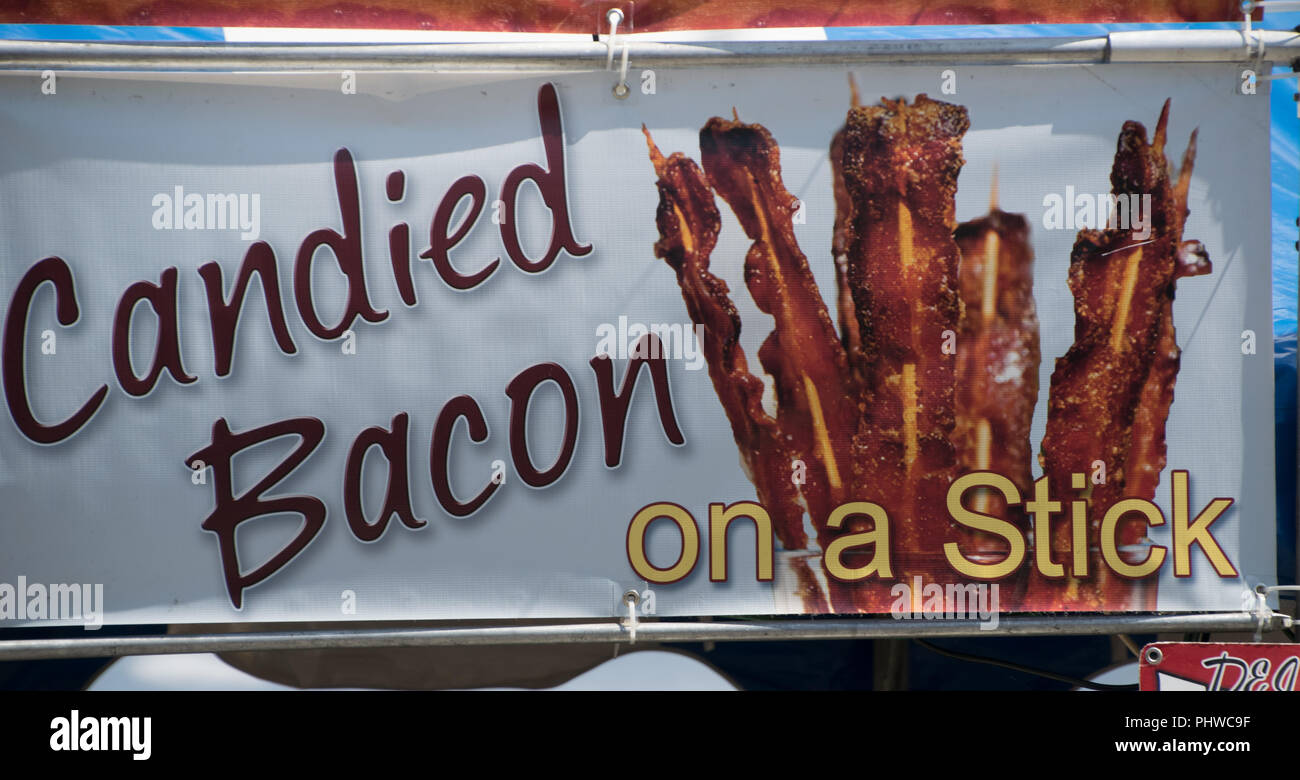 Sign for candied bacon on a stick at the Matthews Alive street fair on ...