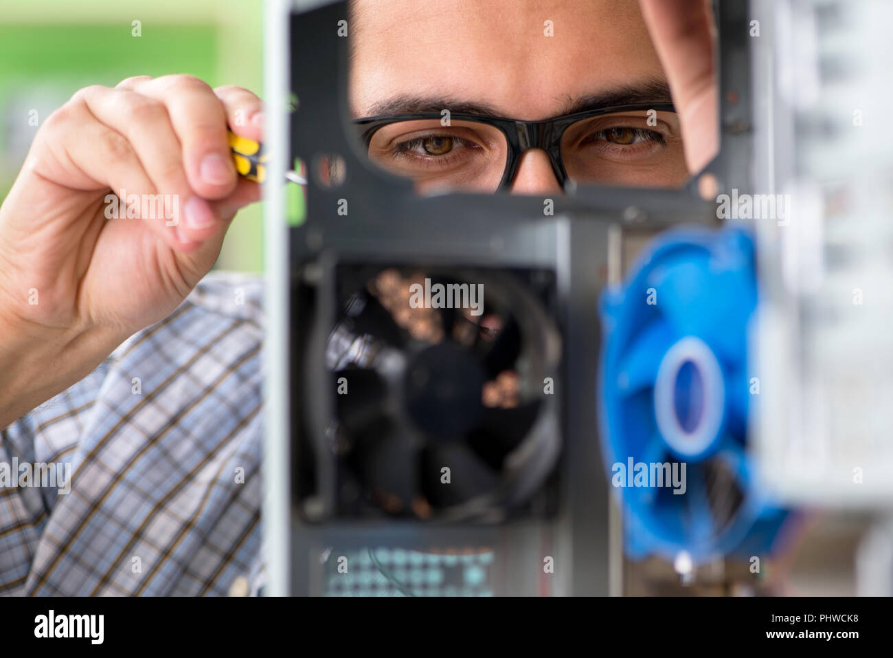 Computer engineer repairing broken desktop Stock Photo - Alamy