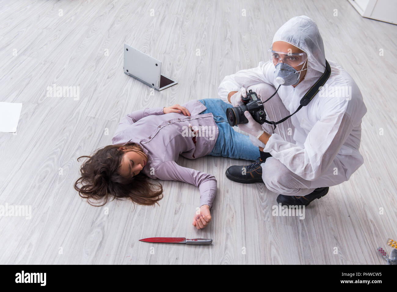Forensic Investigator At The Crime Scene Investigating Woman Mur Stock