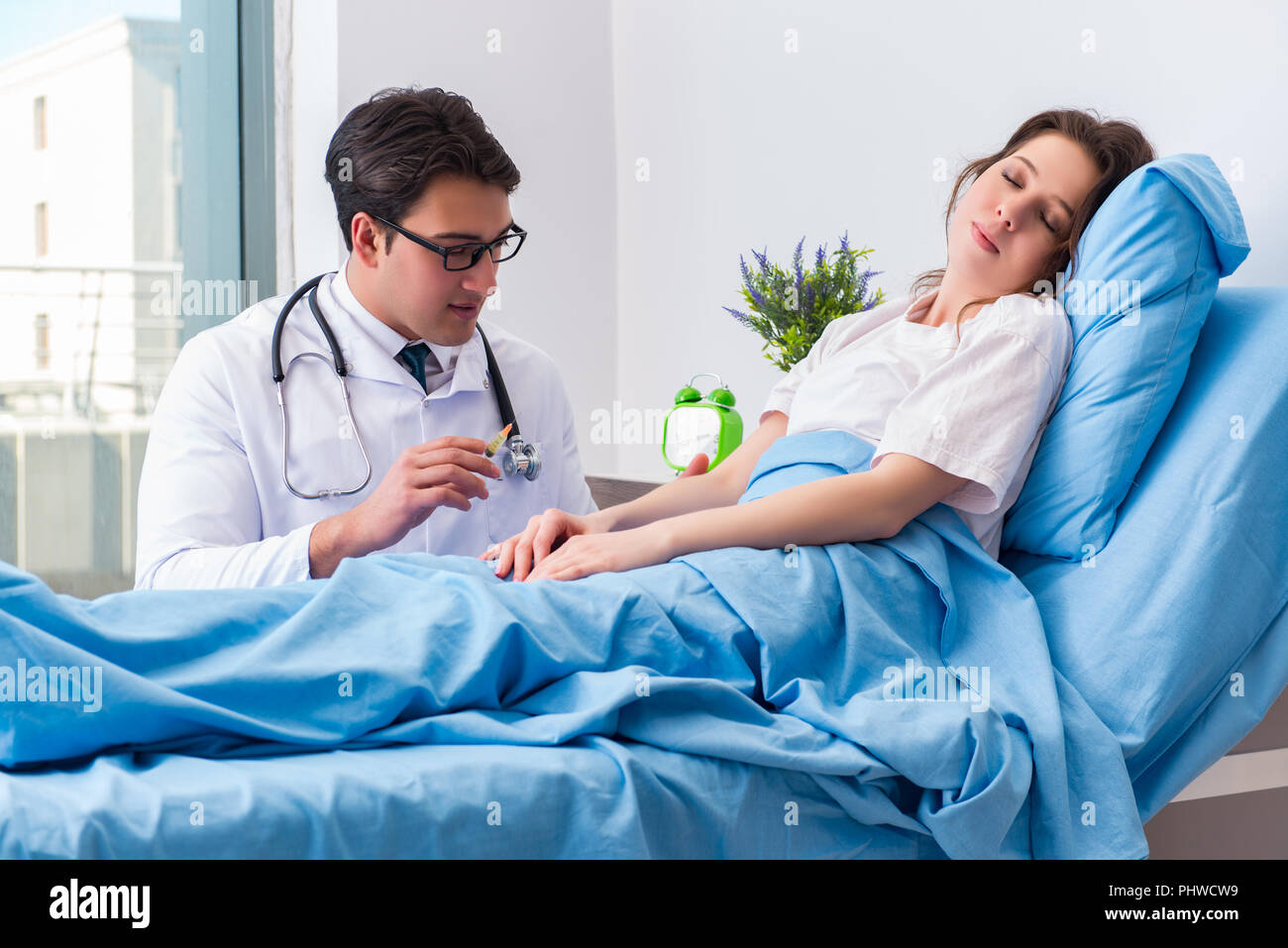 Doctor doing medical injection in hospital room Stock Photo - Alamy