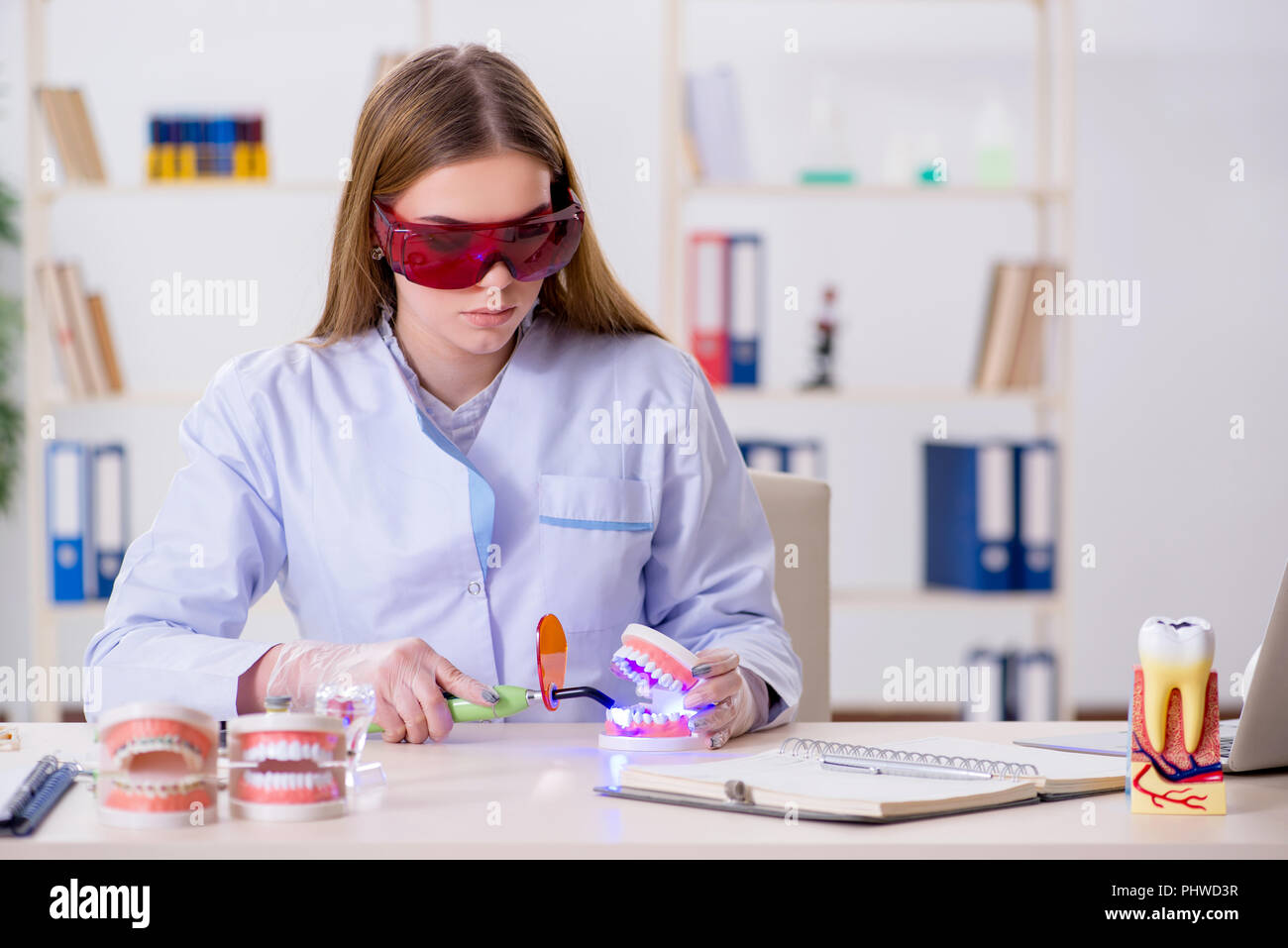 Dentistry student practicing skills in classroom Stock Photo - Alamy