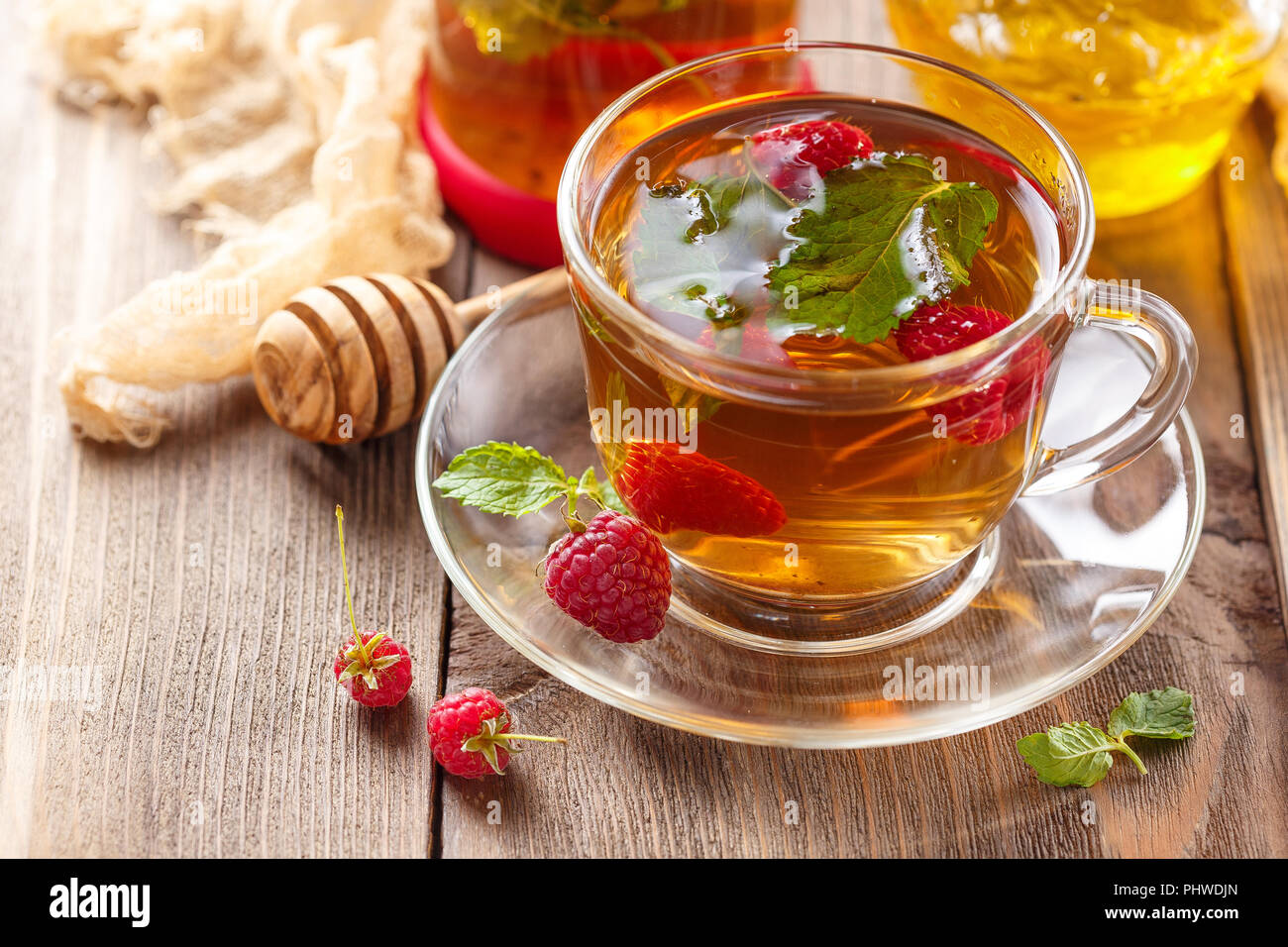 Tea with mint and raspberry Stock Photo - Alamy
