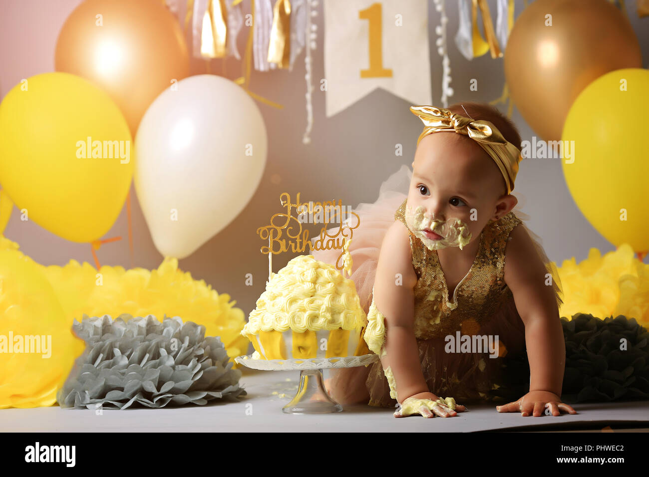 Little baby birthday one year girl crushing her yellow cake Stock Photo ...