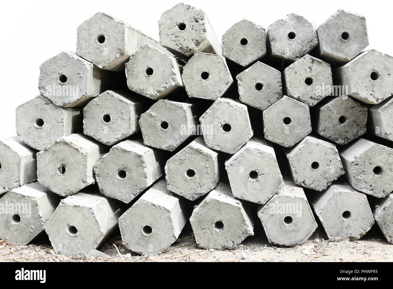 The pile of hexagon concrete foundation piles isolated Stock Photo - Alamy