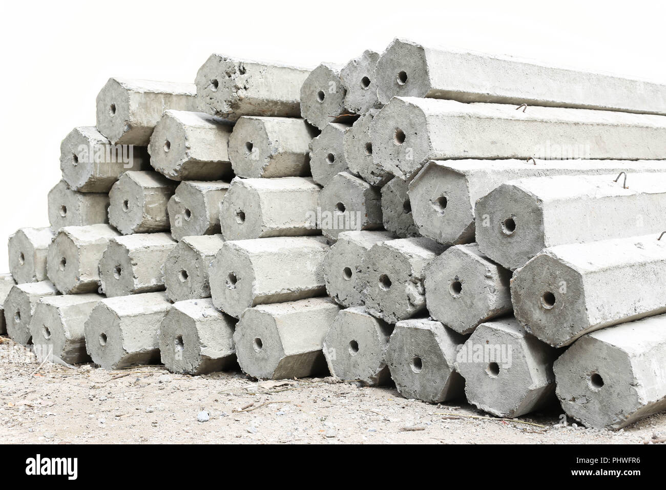 The pile of hexagon concrete foundation piles isolated Stock Photo - Alamy