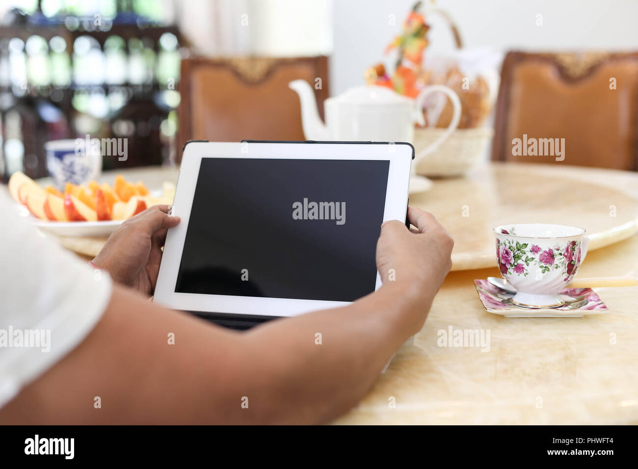 Man working on tablet Stock Photo - Alamy