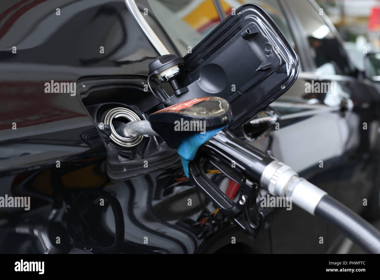 Pumping gasoline fuel in car Stock Photo - Alamy